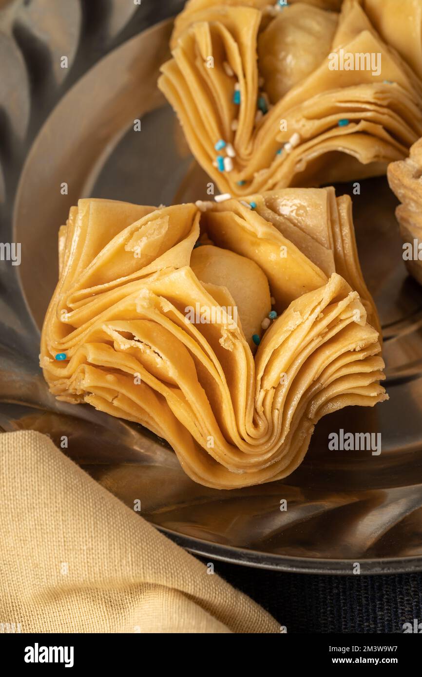 Fried pastries stuffed with sweet potato or quince on stainless steel ...