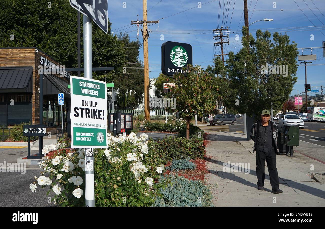 Los Angeles, USA. 16th Dec, 2022. A man walks by a strike sign near a ...