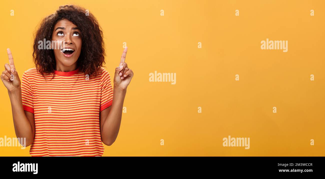 Optimistic happy african american girl saying thanks to god looking and ...