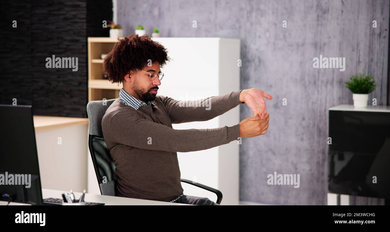 Stretch Exercise Workout At Office Business Desk Stock Photo - Alamy