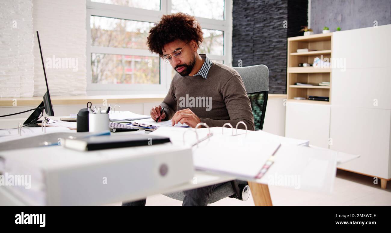 Portrait Of A Accountant Man Calculating Invoice Stock Photo - Alamy