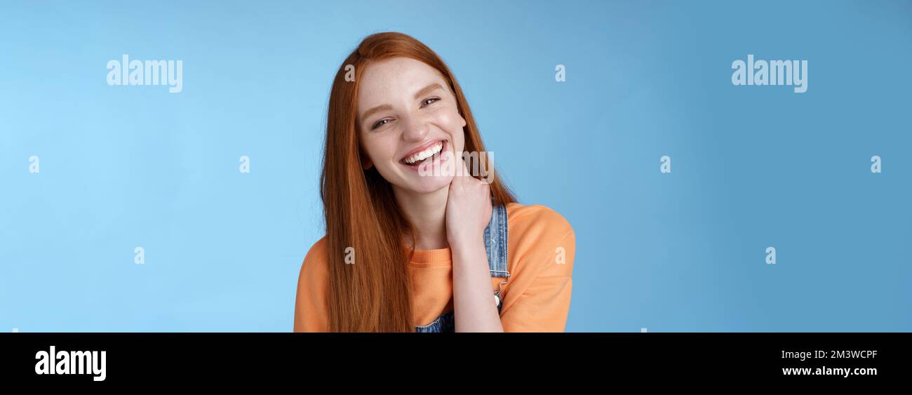 Carefree silly flirty young redhead girlfriend having fun enjoying ...