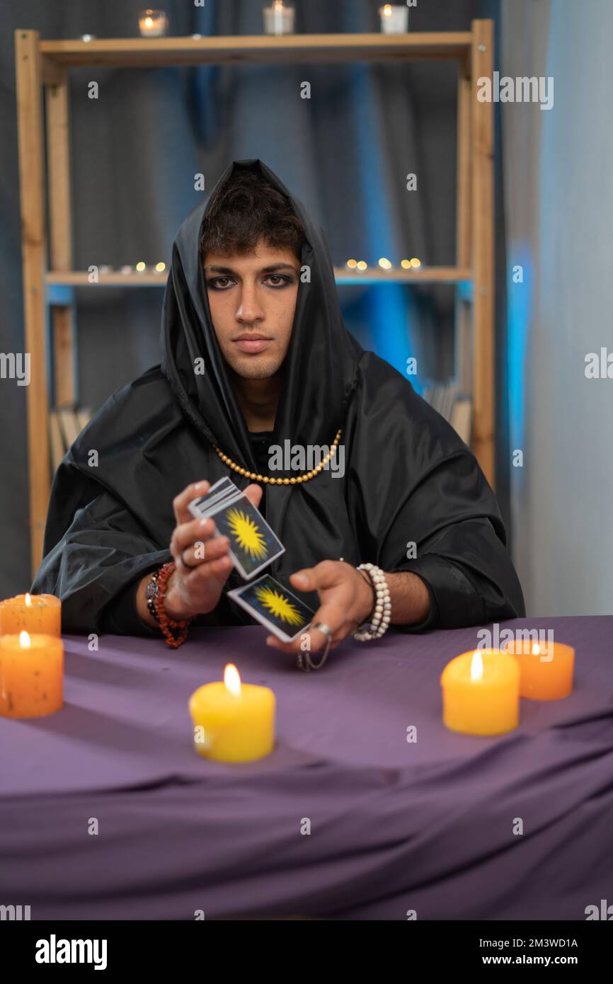 Fortune teller magical man reading future on tarot cards. Ritual ...
