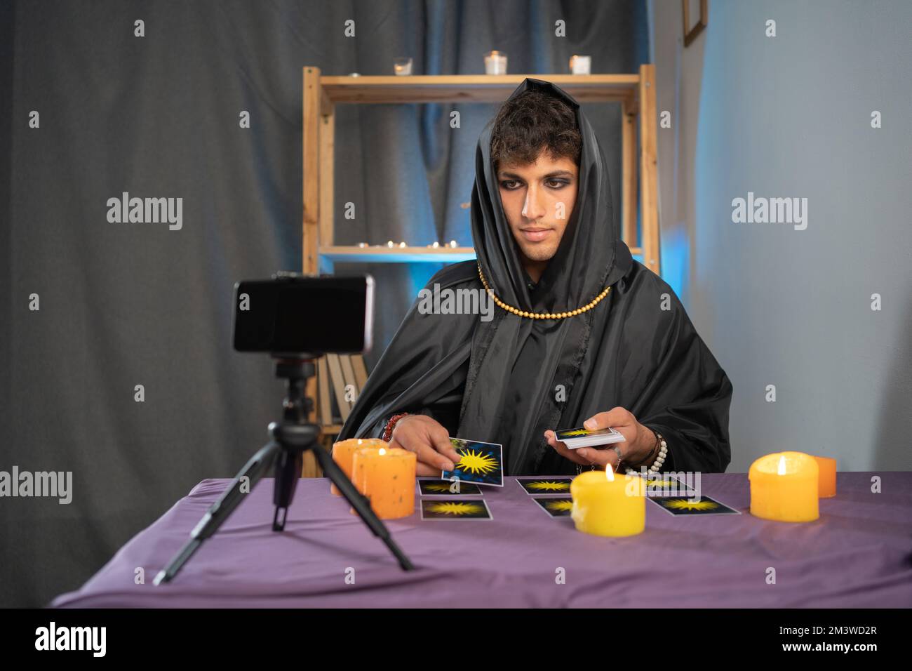 Tarot reader picking tarot cards who lie face down on table near ...