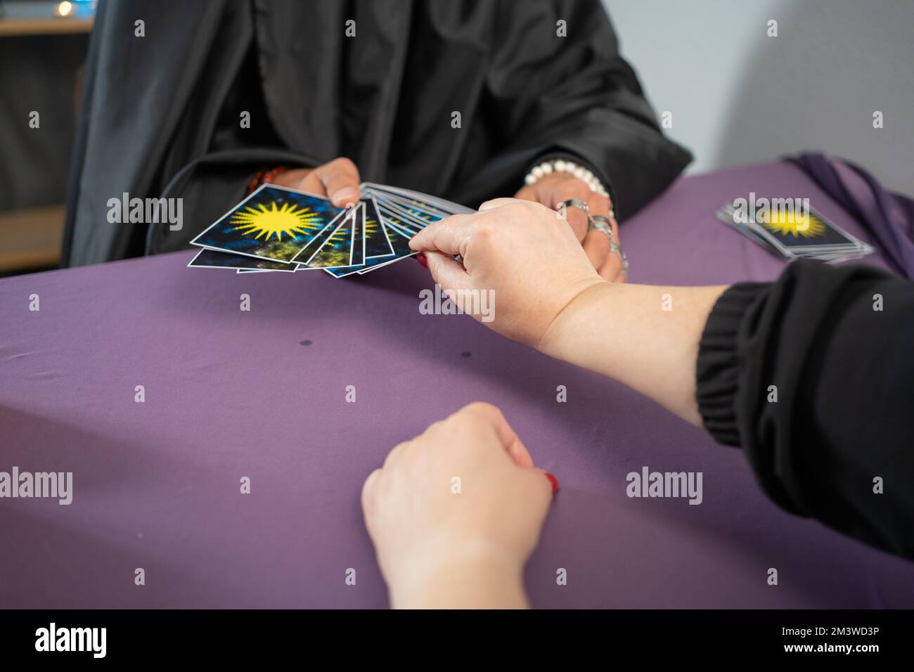 The Pythoness chooses a Tarot card in an esoteric session Stock Photo ...