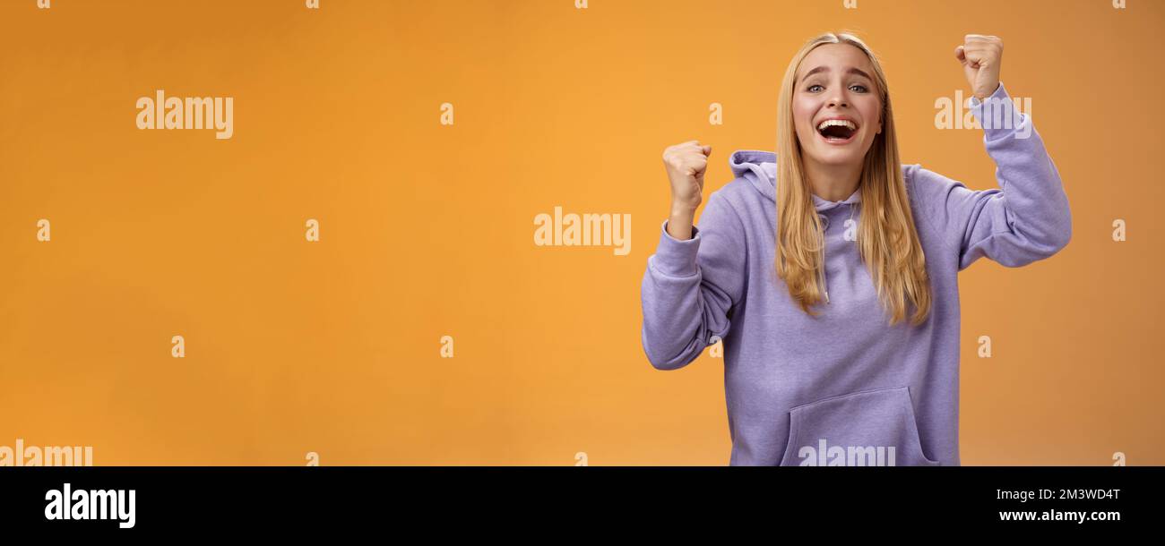 Happy cheerful young supportive woman cheering sister win smiling ...