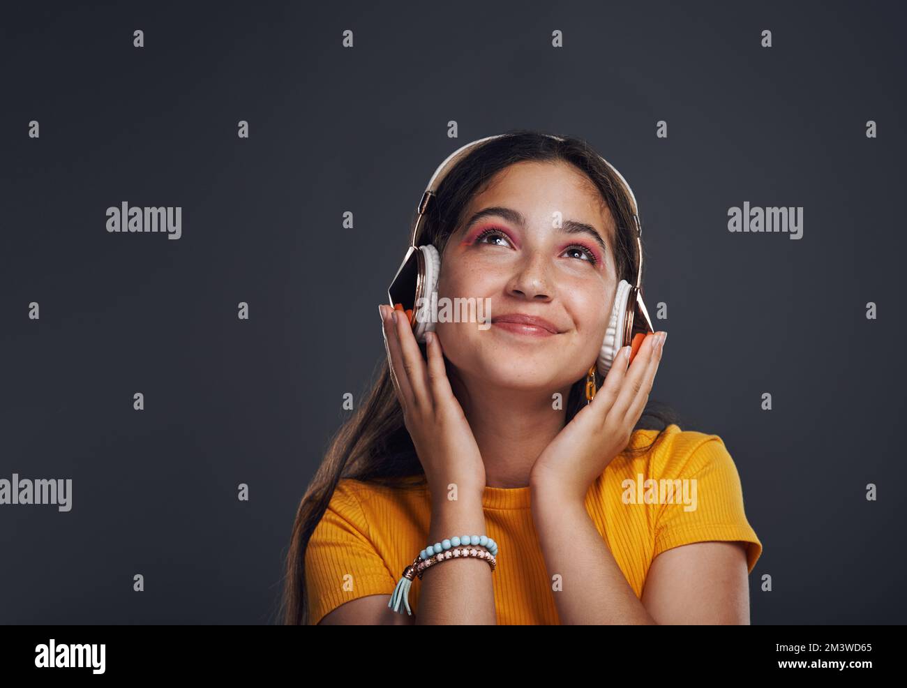Listen music pose hi-res stock photography and images - Alamy
