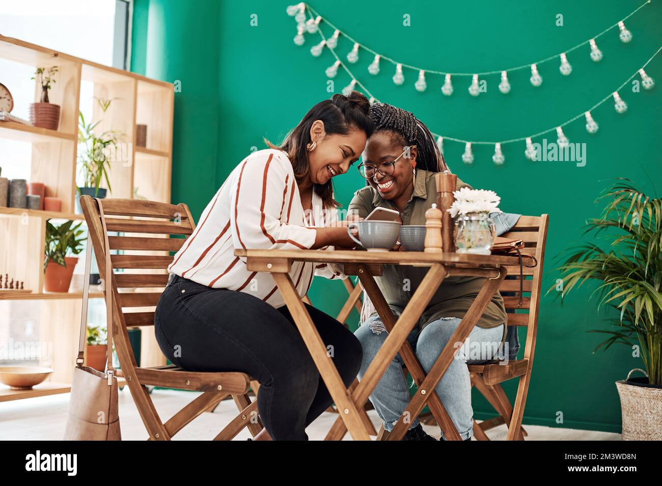 Theres someone I want to introduce you to. two young women using a ...