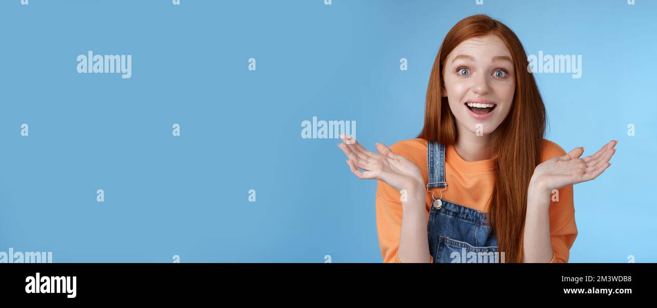 Amused surprised glad young redhead girl speechless happy see friend ...