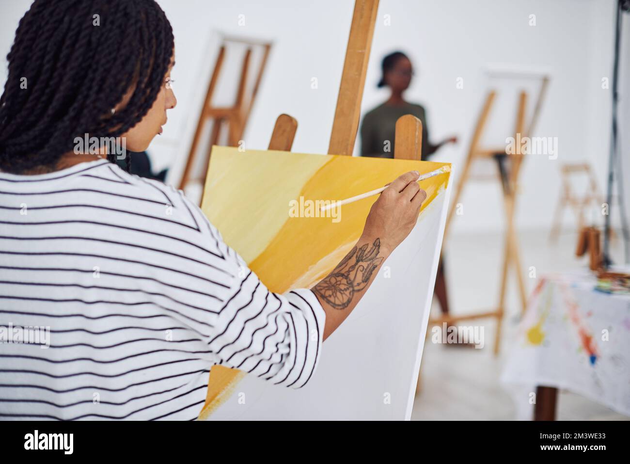 Painting is a way of connecting with your inner self. a beautiful young ...