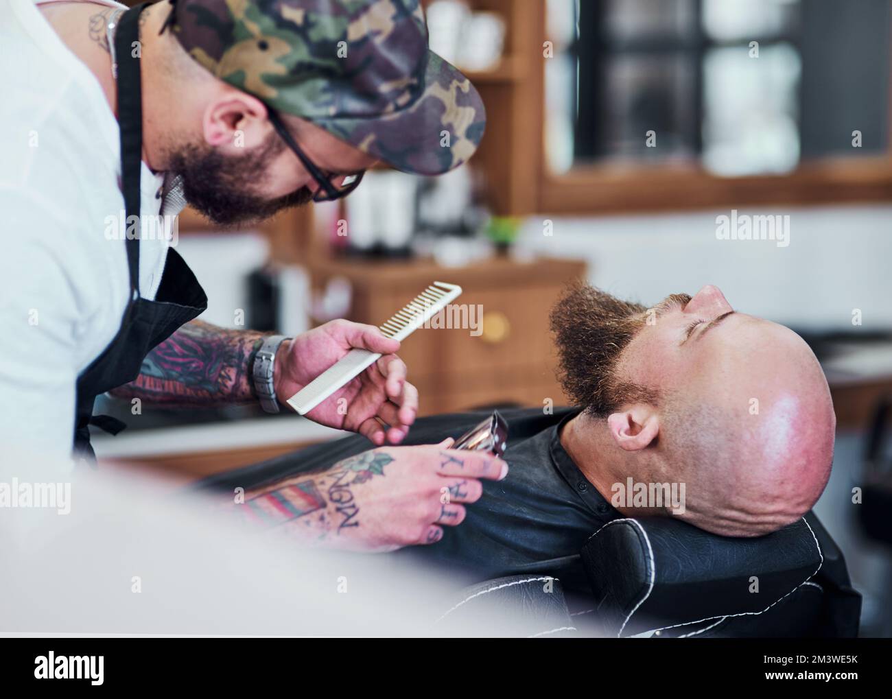 Just giving the beard a fresh shape up. a handsome young man getting ...