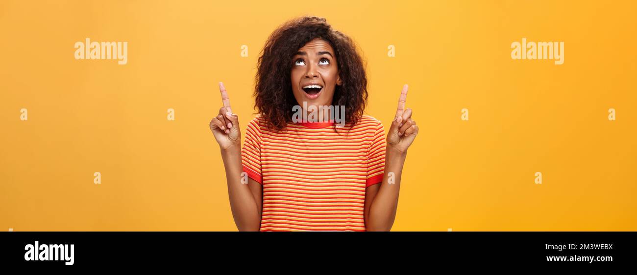 Optimistic happy african american girl saying thanks to god looking and ...