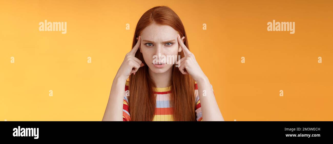 Puzzled serious-looking stressed-out young tired female student ...