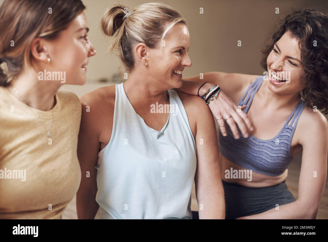 Friends who do yoga together stick together. a young group of women ...