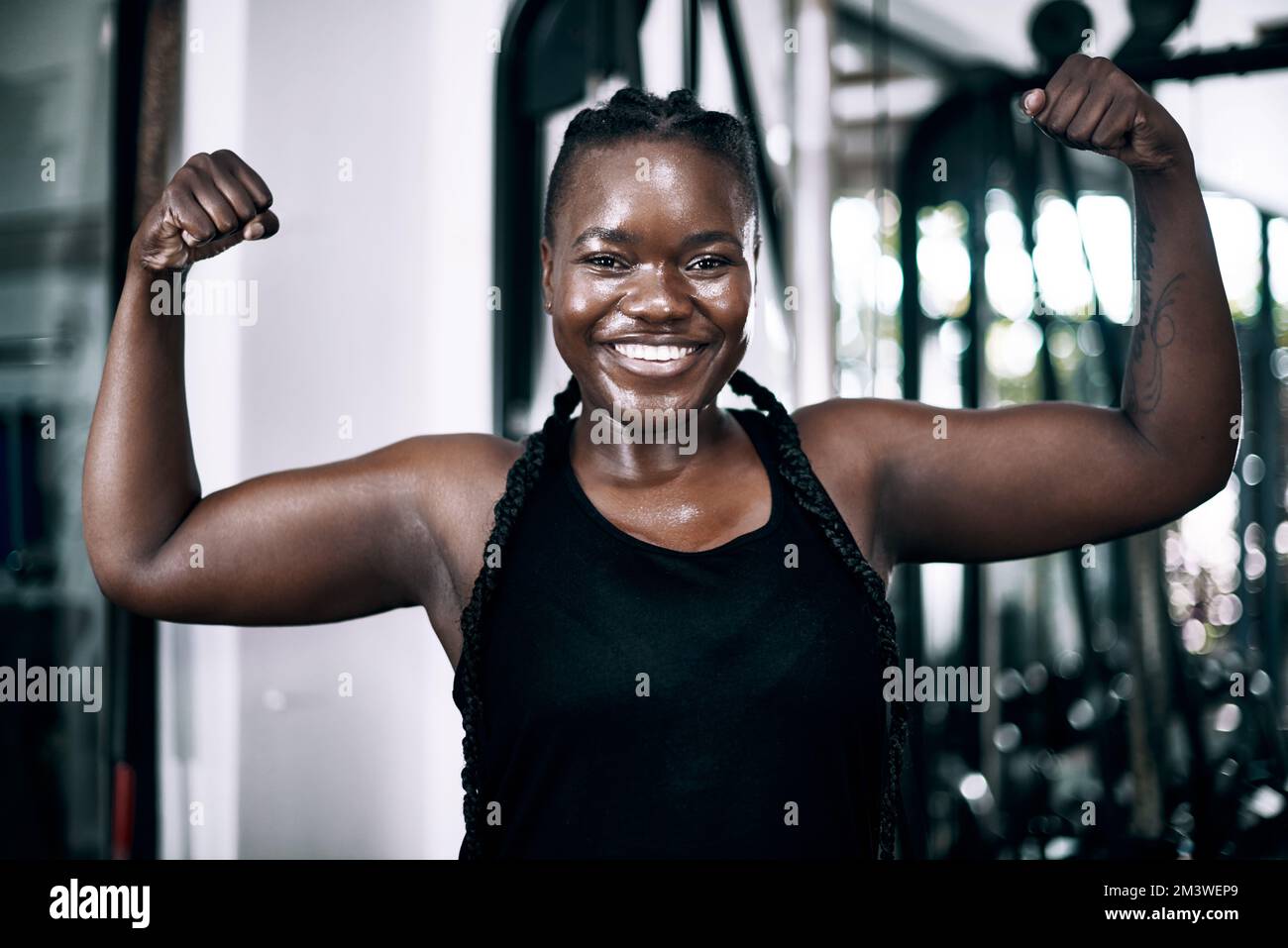 Time for the gun show. Cropped portrait of an attractive young female ...