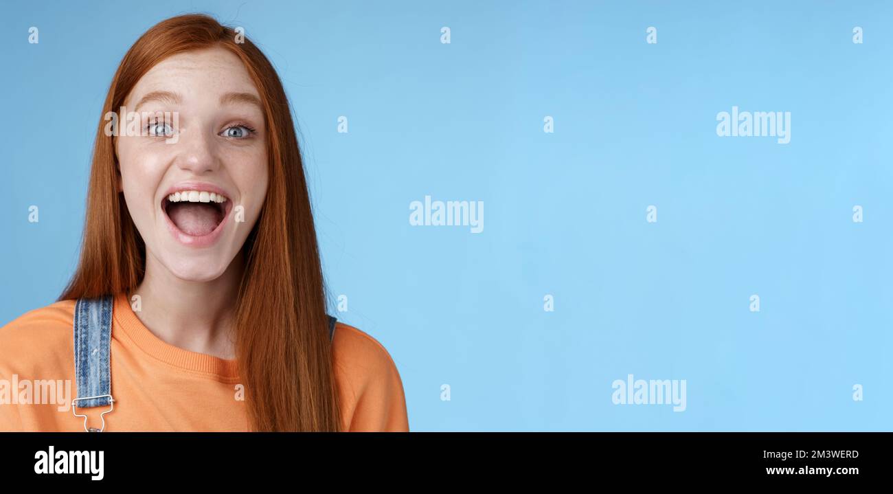 Amused charismatic lively outgoing ginger girl thrilled having fun ...