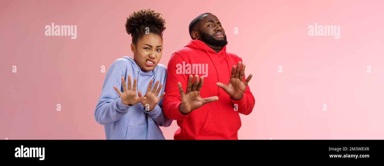 Studio shot pair african american friends woman man cringing disgust ...