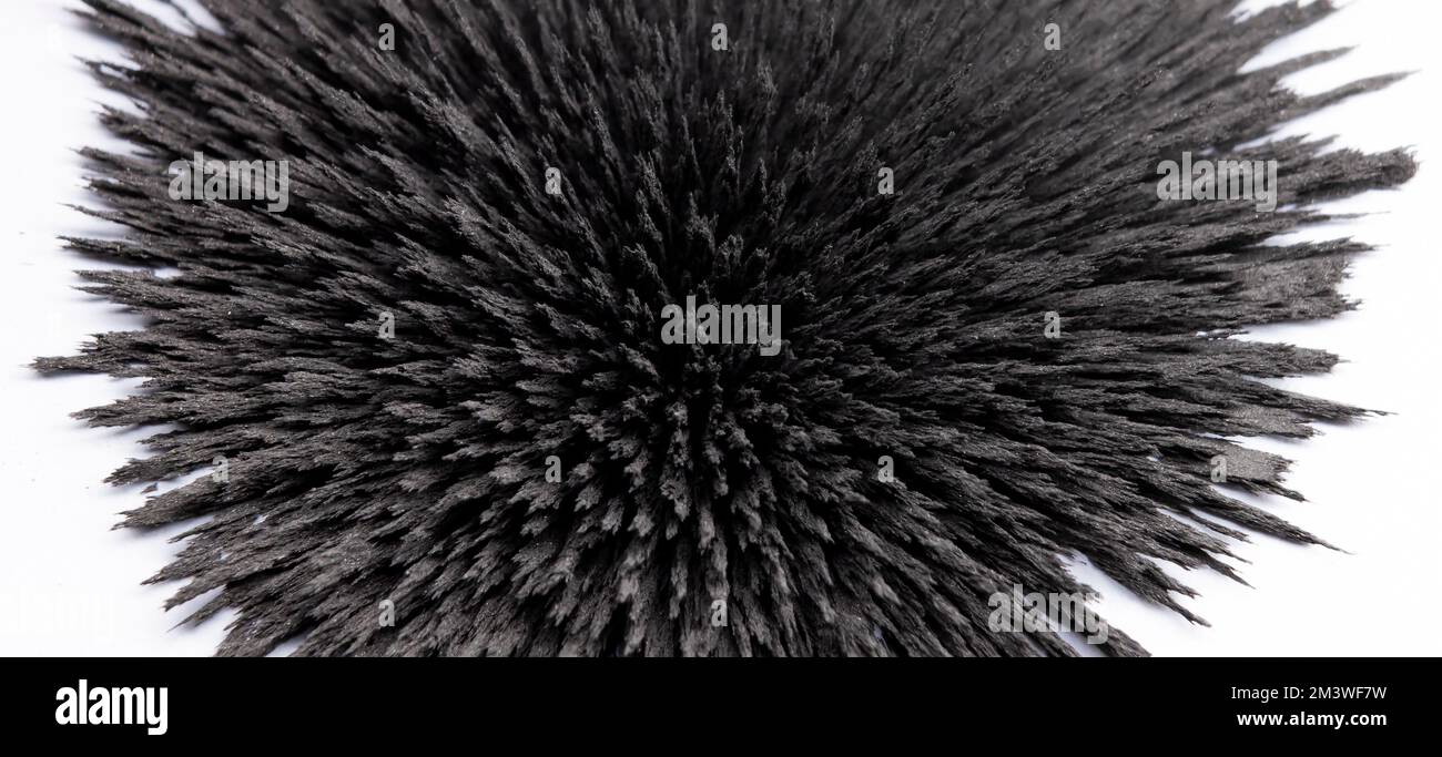 The macro texture of the black iron dust on the white background Stock ...
