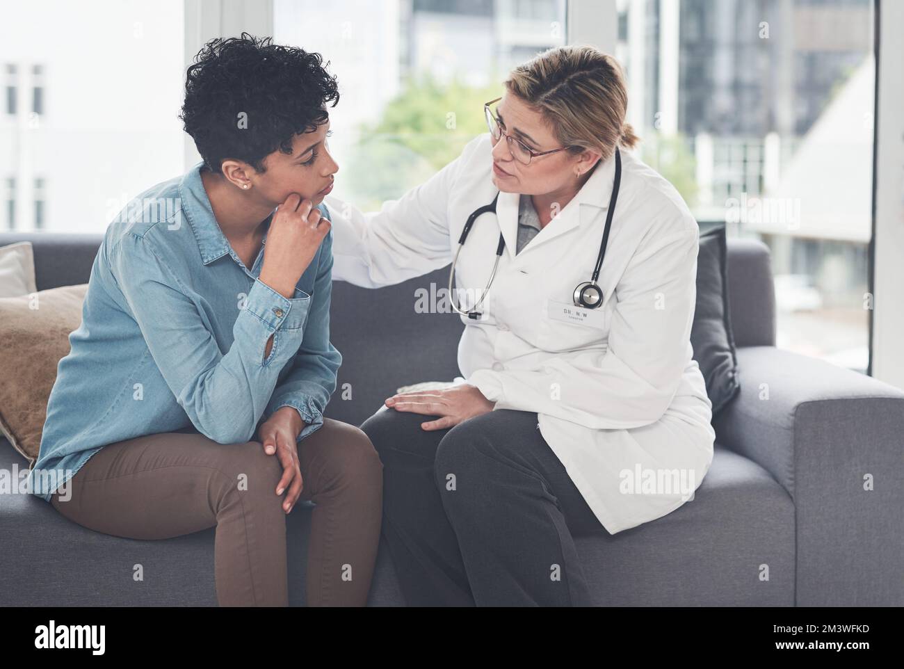 You will overcome this...a compassionate young female doctor consoling ...