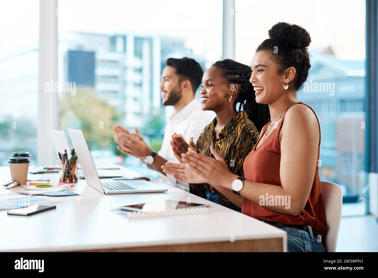 Well done. a diverse group of businesspeople sitting in the office ...
