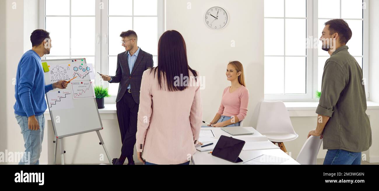 Banner of team leaders make whiteboard presentation Stock Photo - Alamy