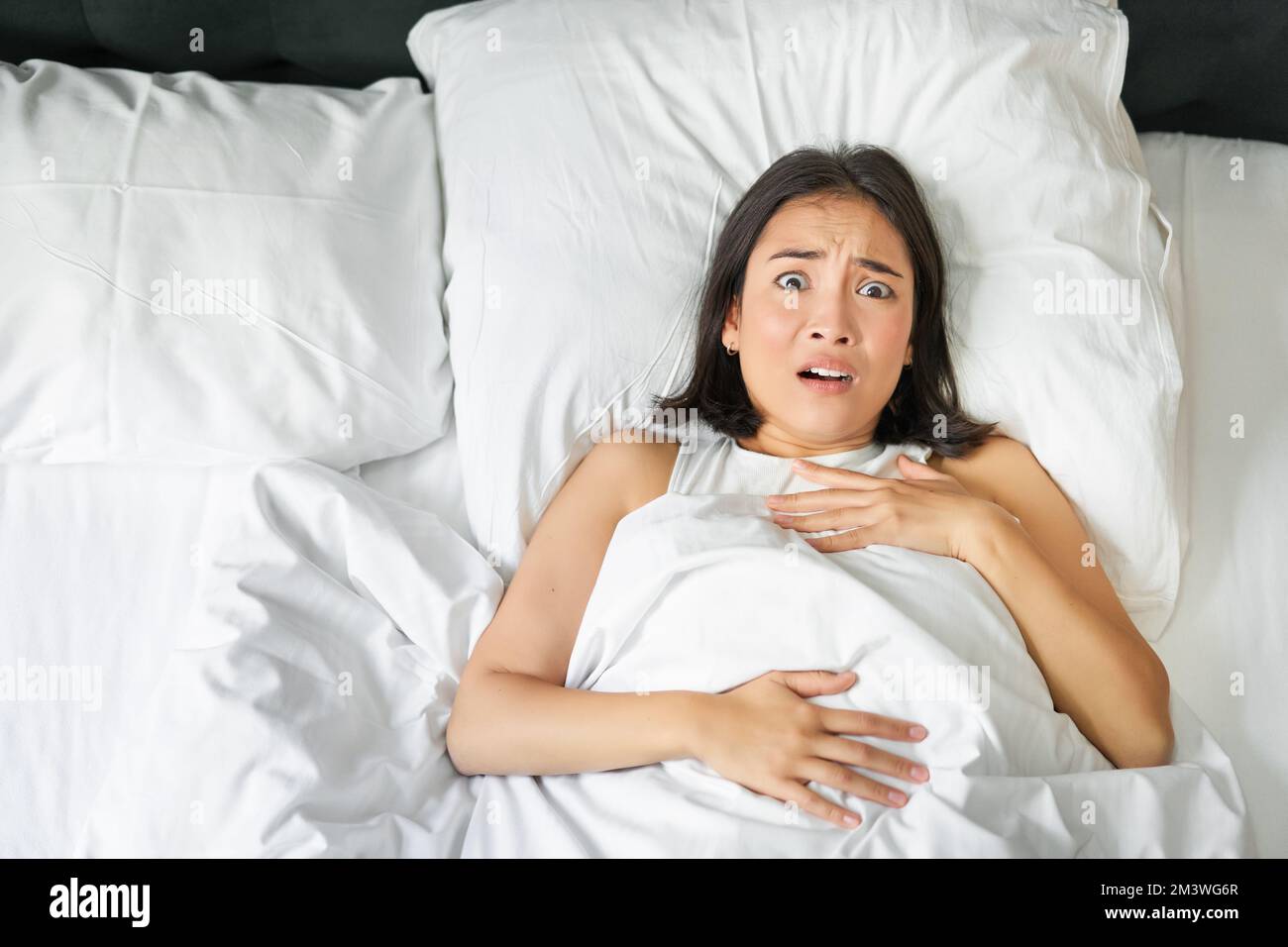 Portrait of young korean woman looks freaked out. Concerned asian girl ...