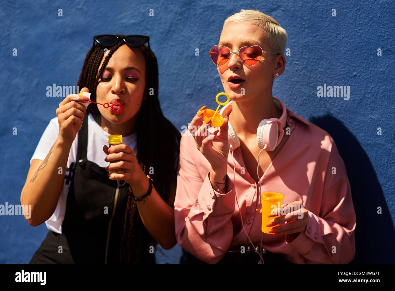 Bringing out the inner children within us. two attractive young women ...