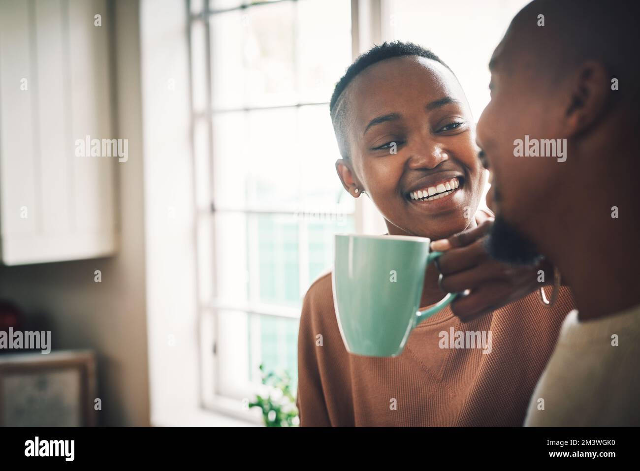 Coffee and conversation to start the day off. a beautiful young woman ...