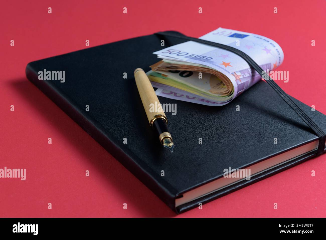 money counting. Accounting black book, euro banknotes and fountain pen ...