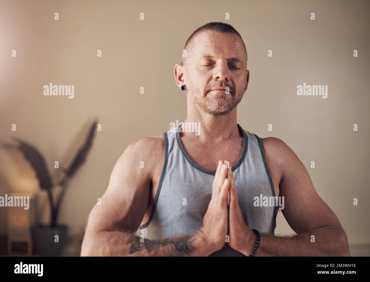 One handsome man meditating hi-res stock photography and images - Alamy