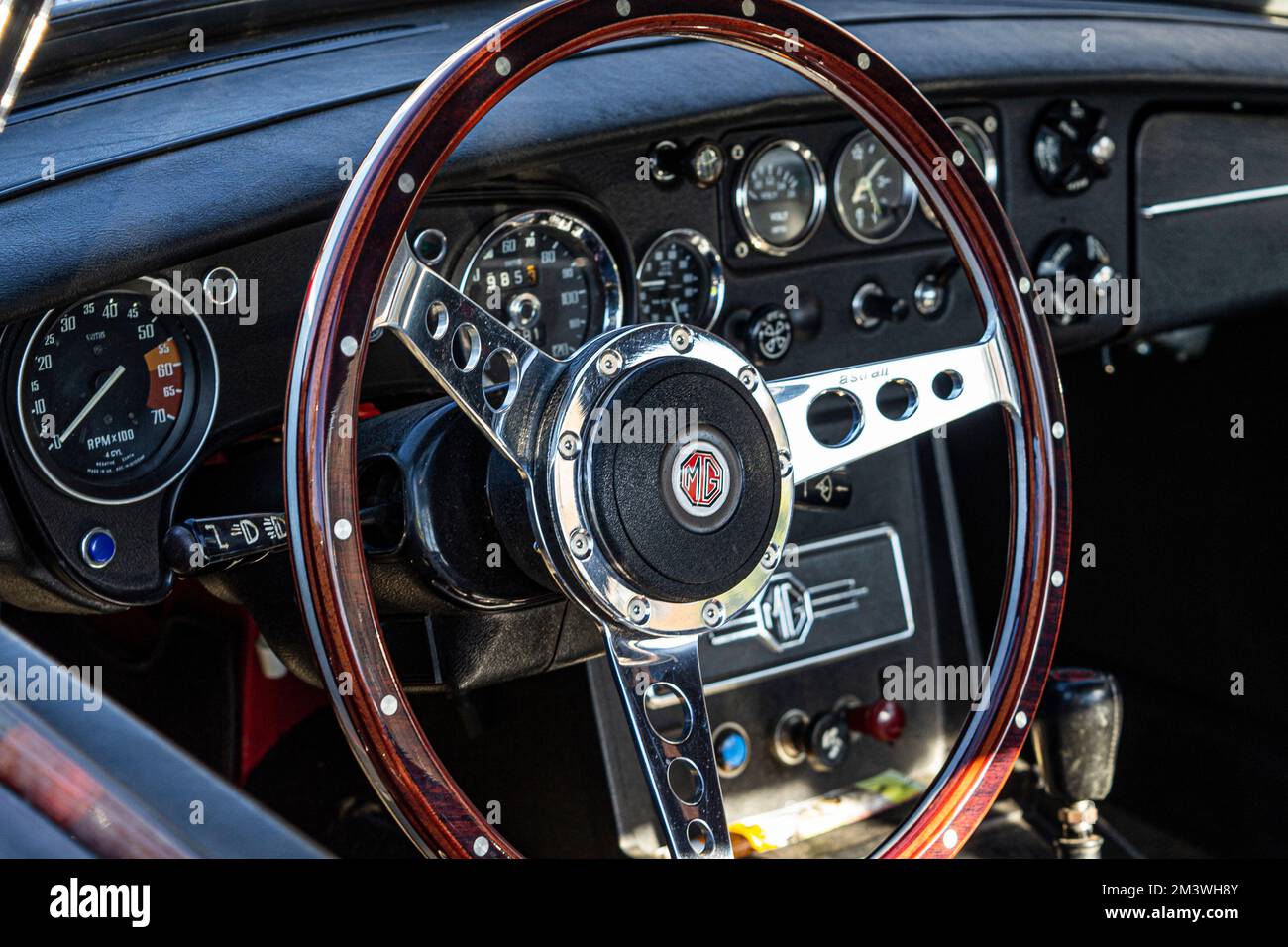 An interior view of a vintage MGB two-door sports car from the 1960s ...