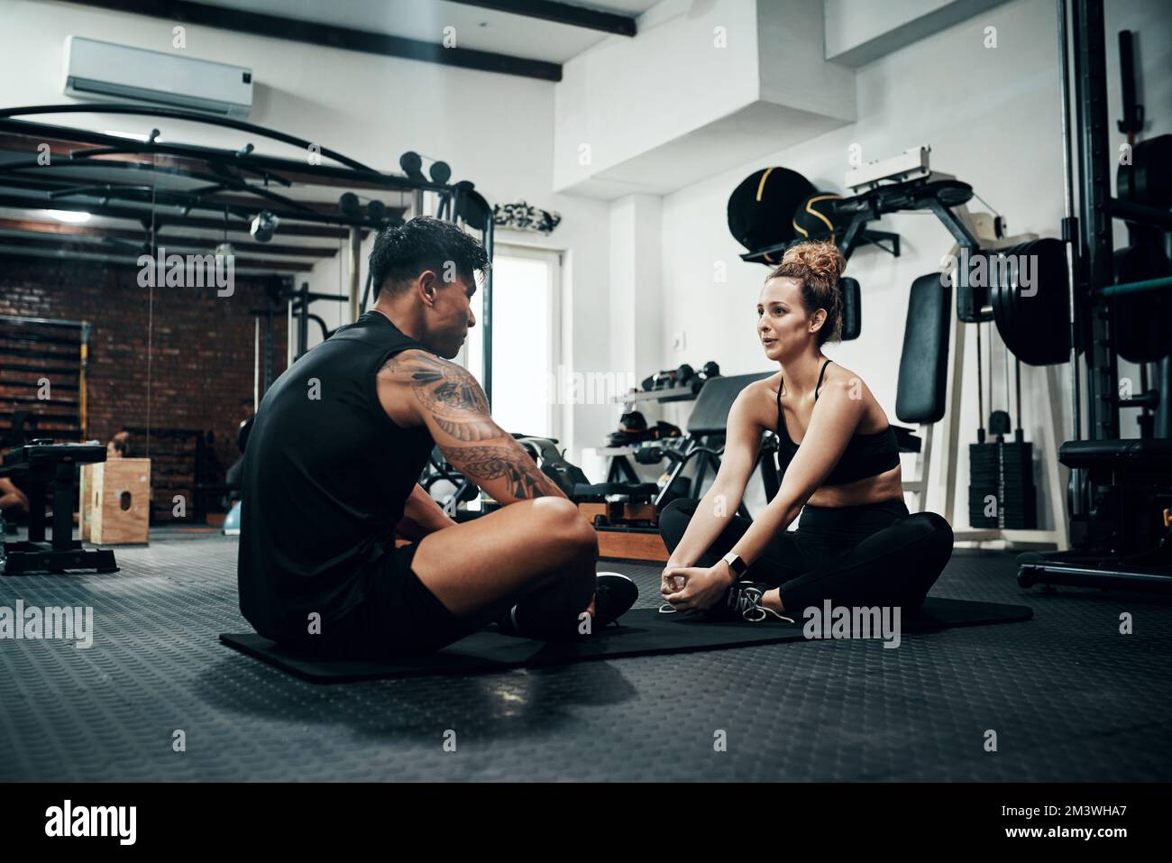 Bonding while getting fit at the same time. two sporty young people ...