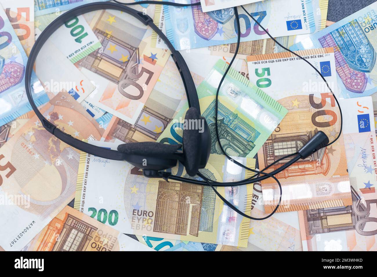 euro banknotes headphones headset. Money and technology still life ...