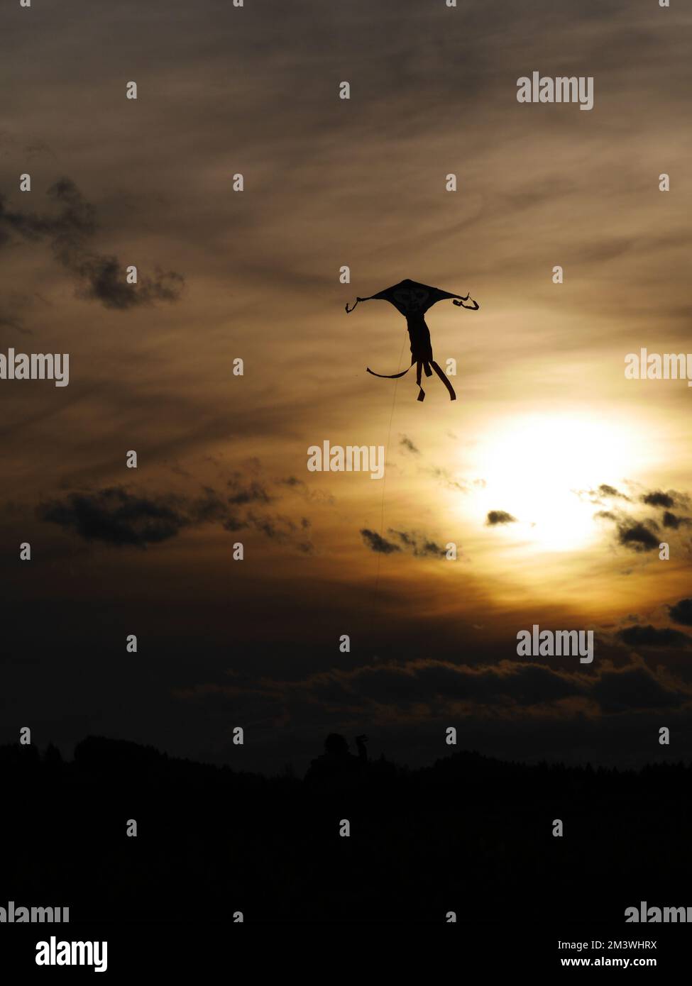 Flying kite sunset hi-res stock photography and images - Alamy