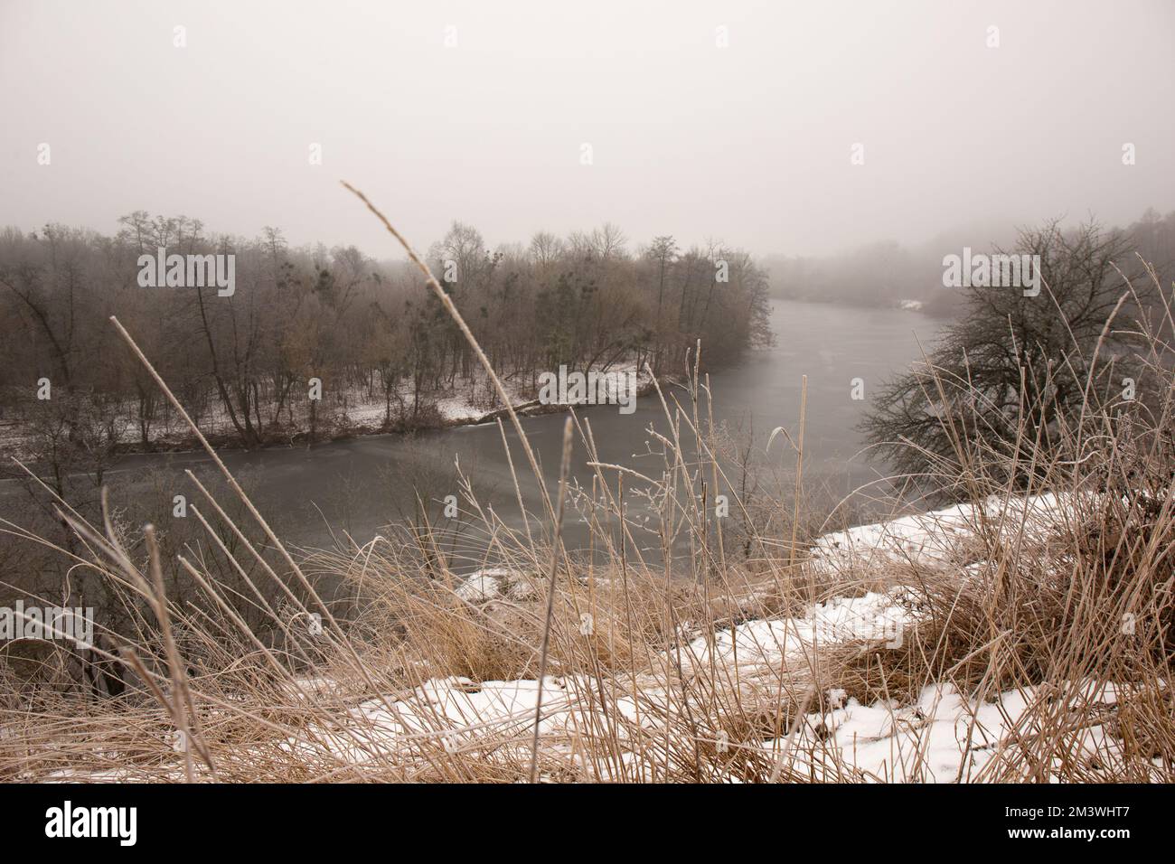 Winter view of the frozen river from a high cliff Stock Photo - Alamy