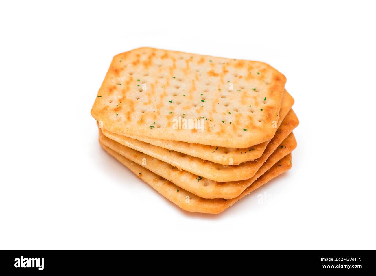 Stack of Crispy Salted Crackers with Greens - Isolated on White. Easy ...