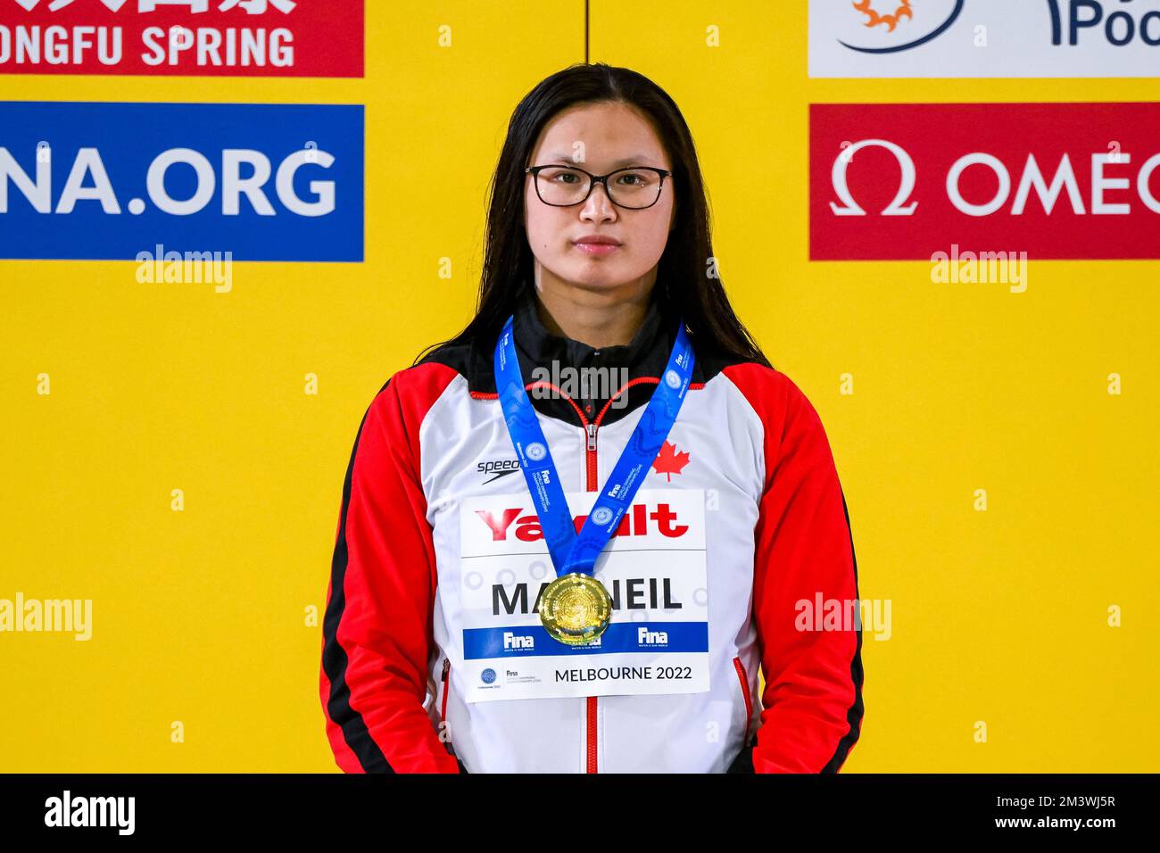 Margaret Macneil of Canada stands with the gold medal after compete in ...