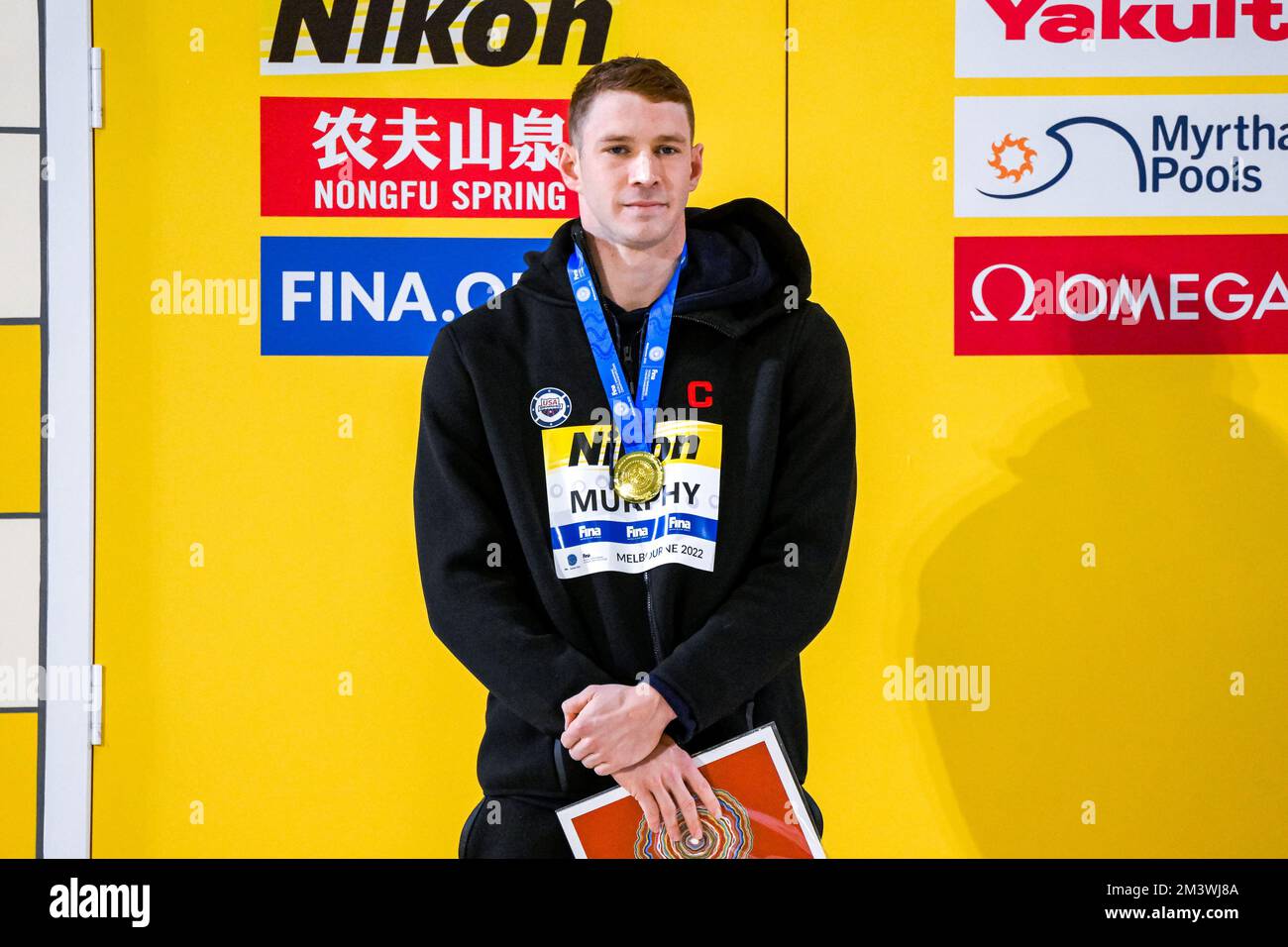 Ryan Murphy of United States of America stands with the gold medal ...