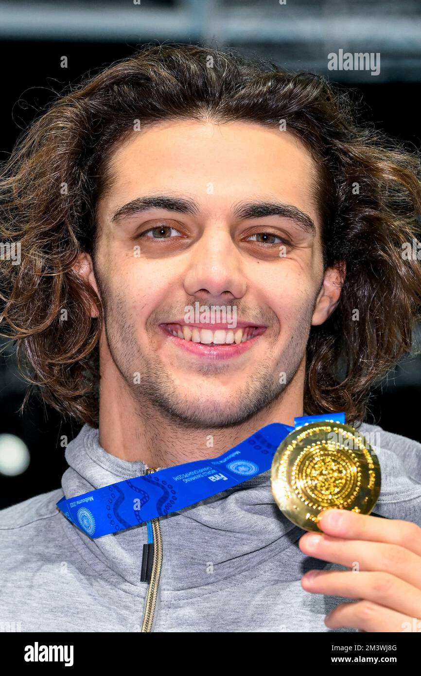 Thomas Ceccon of Italy shows the gold medal after compete in the 100m ...