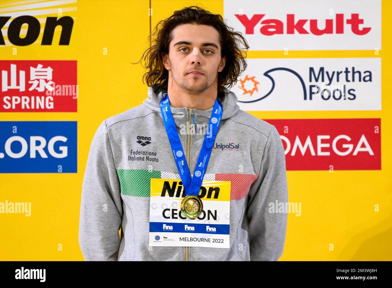 Thomas Ceccon of Italy stands with the gold medal after compete in the ...