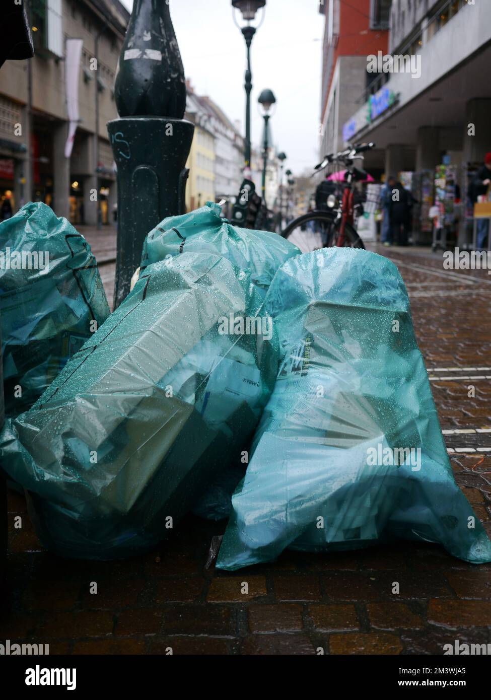 lot of filled bin liner street Stock Photo - Alamy