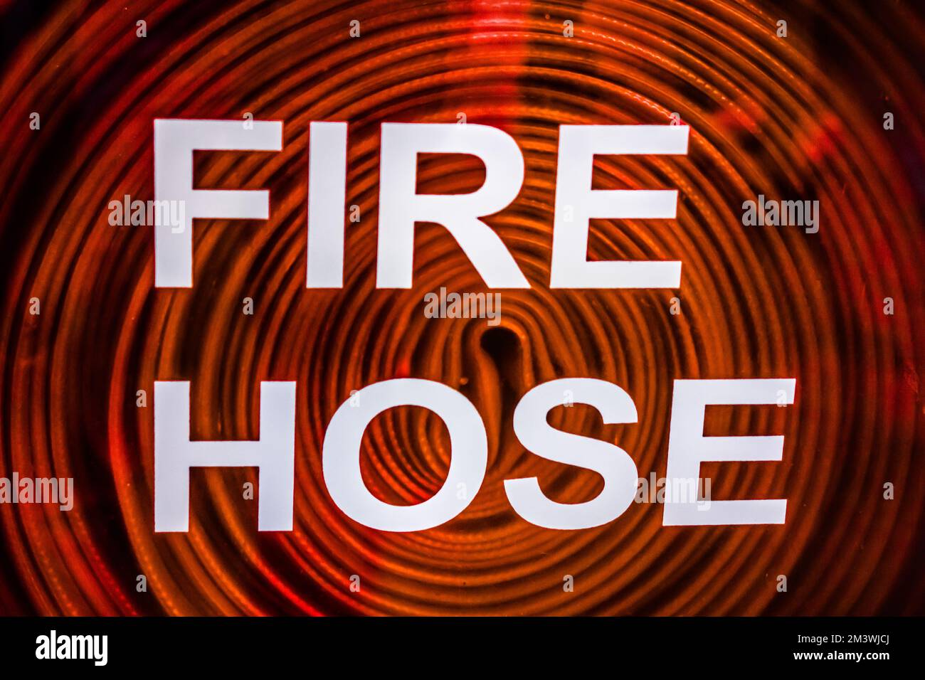 Fire Hose Reels in cabinet for emergency on fire Stock Photo - Alamy