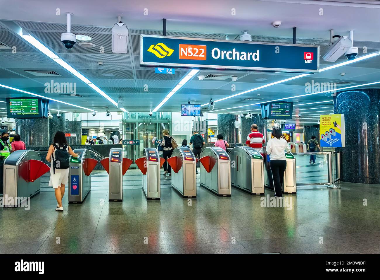 Passengers checking in at Automatic Fare Collection Gates at Orchard ...