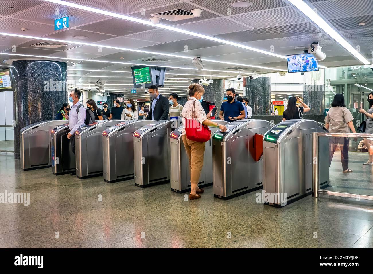 Passengers checking in at Automatic Fare Collection Gates at Orchard ...