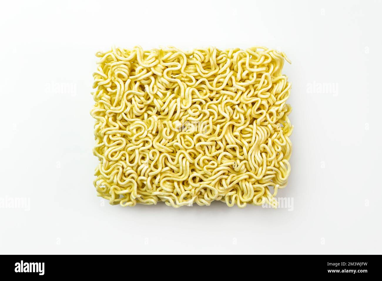 An image of briquette of yellow noodles. chinese noodles Stock Photo ...