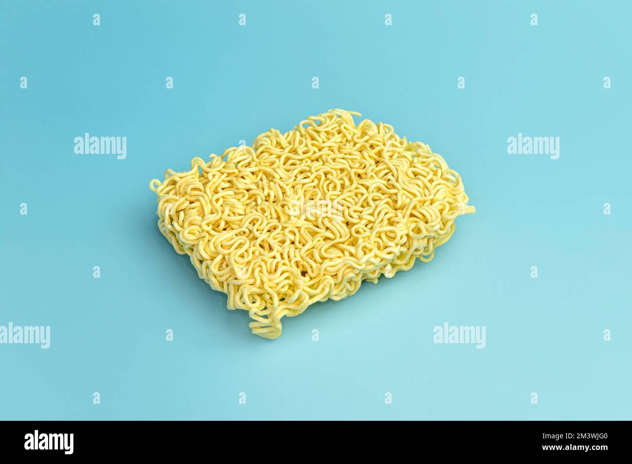 Dried Instant Noodles on the blue table. top view Stock Photo - Alamy