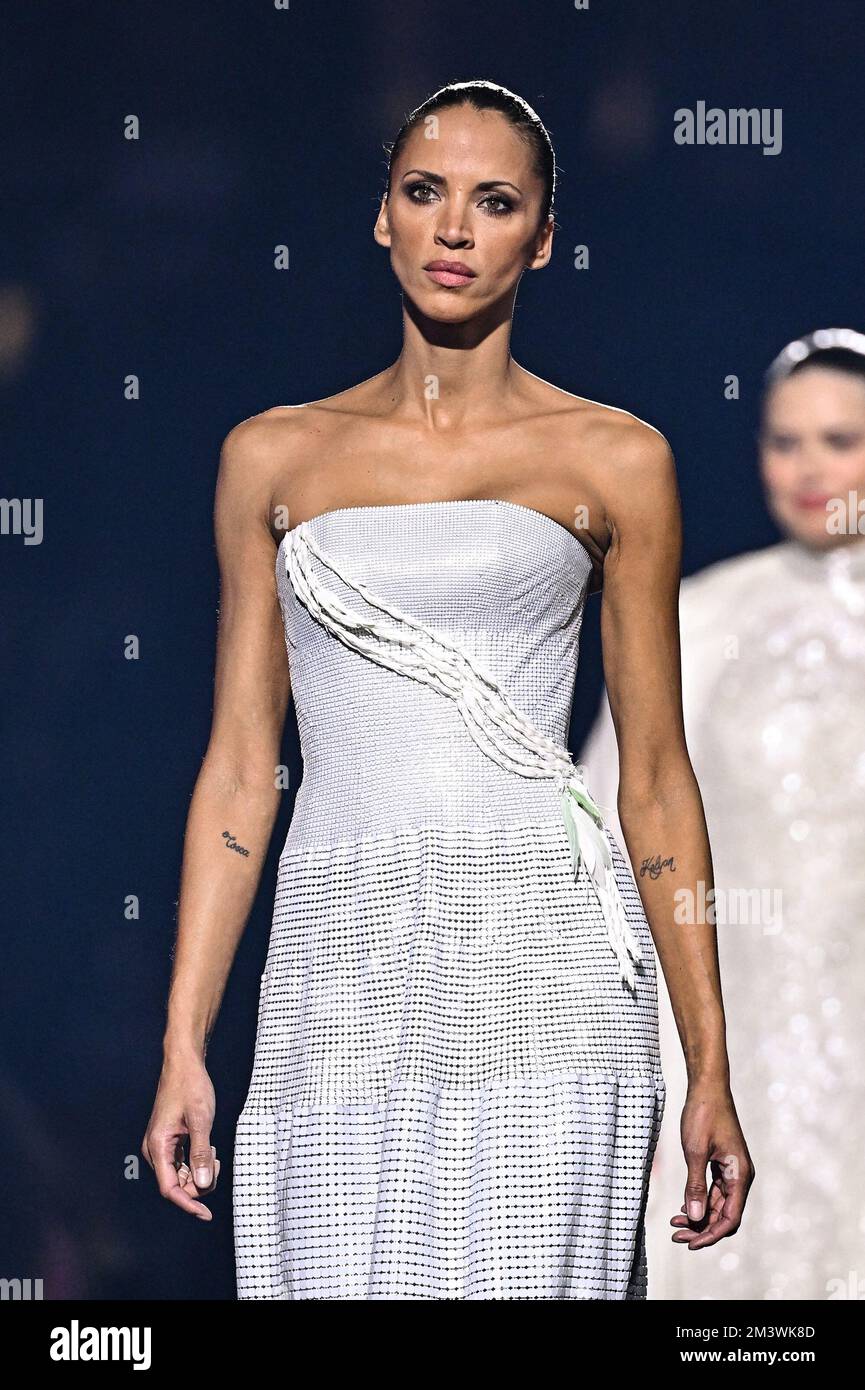 Model Noemie Lenoir walks the runway during the Qatar Fashion United by ...