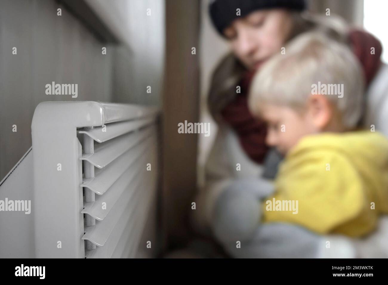 Frozen Mother and Son wearing sweaters shaking and freezing for winter ...