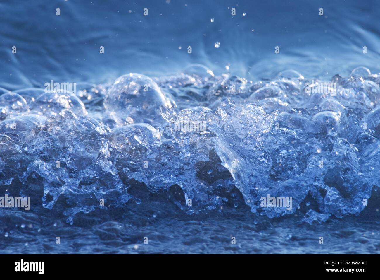 Ocean wave splashing Stock Photo - Alamy