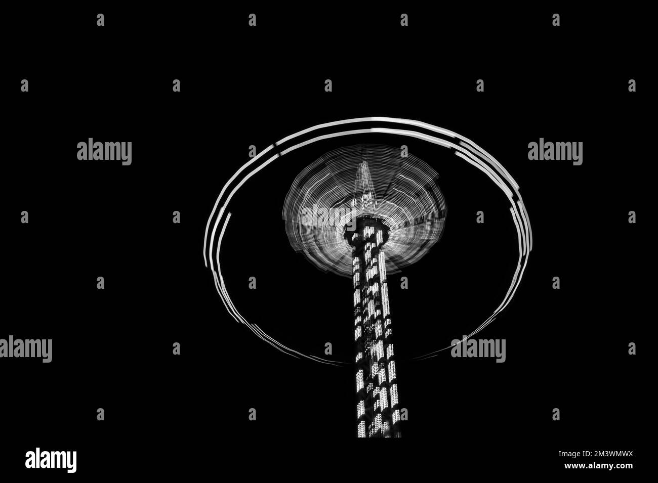 Black and white galaxy. Rotating illuminated attraction in amusement ...